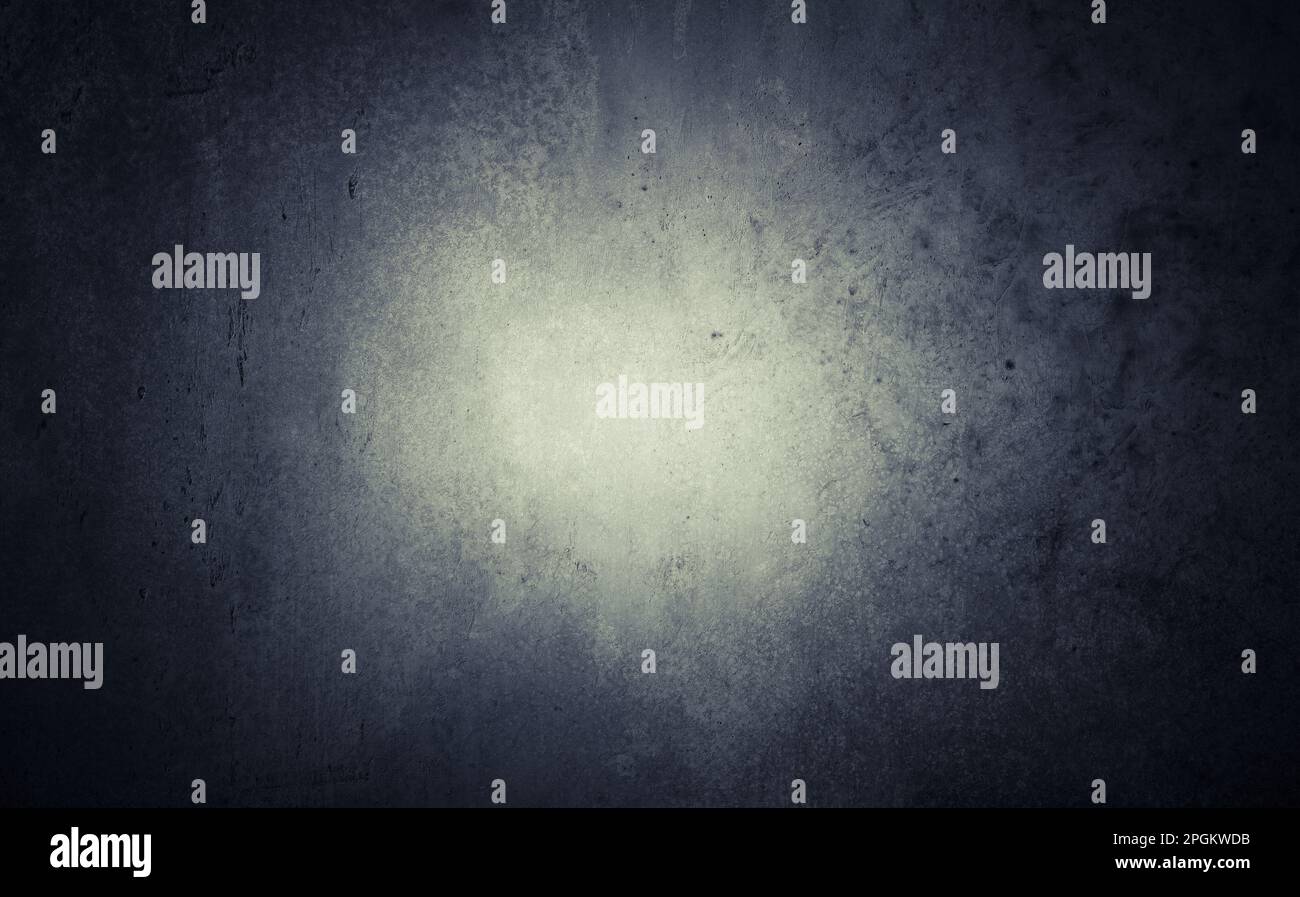 Dark gray blue textured concrete background with bright center light ...