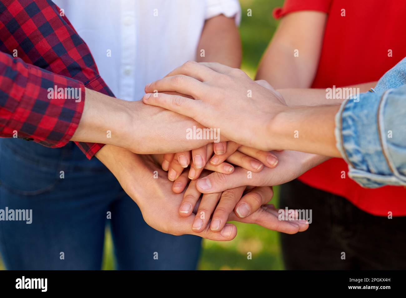 Student teamwork. Closeup of hans together stack Stock Photo - Alamy