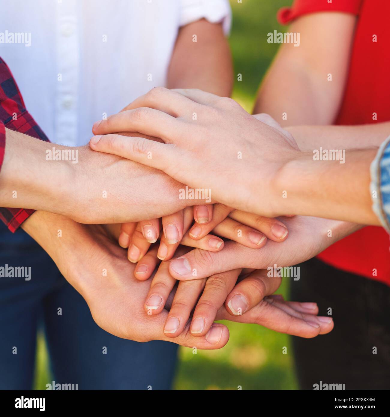 Student teamwork. Closeup of hans together stack Stock Photo - Alamy
