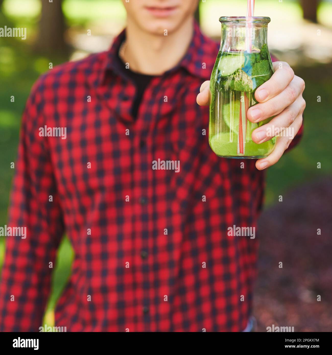 Healthy lifestyle. Happy young man with detox Stock Photo - Alamy