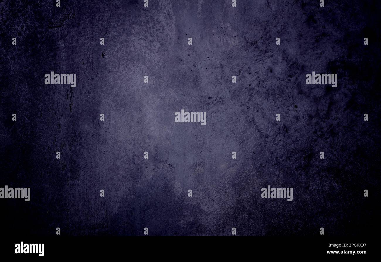 Dark violet textured concrete background with bright center light spot ...
