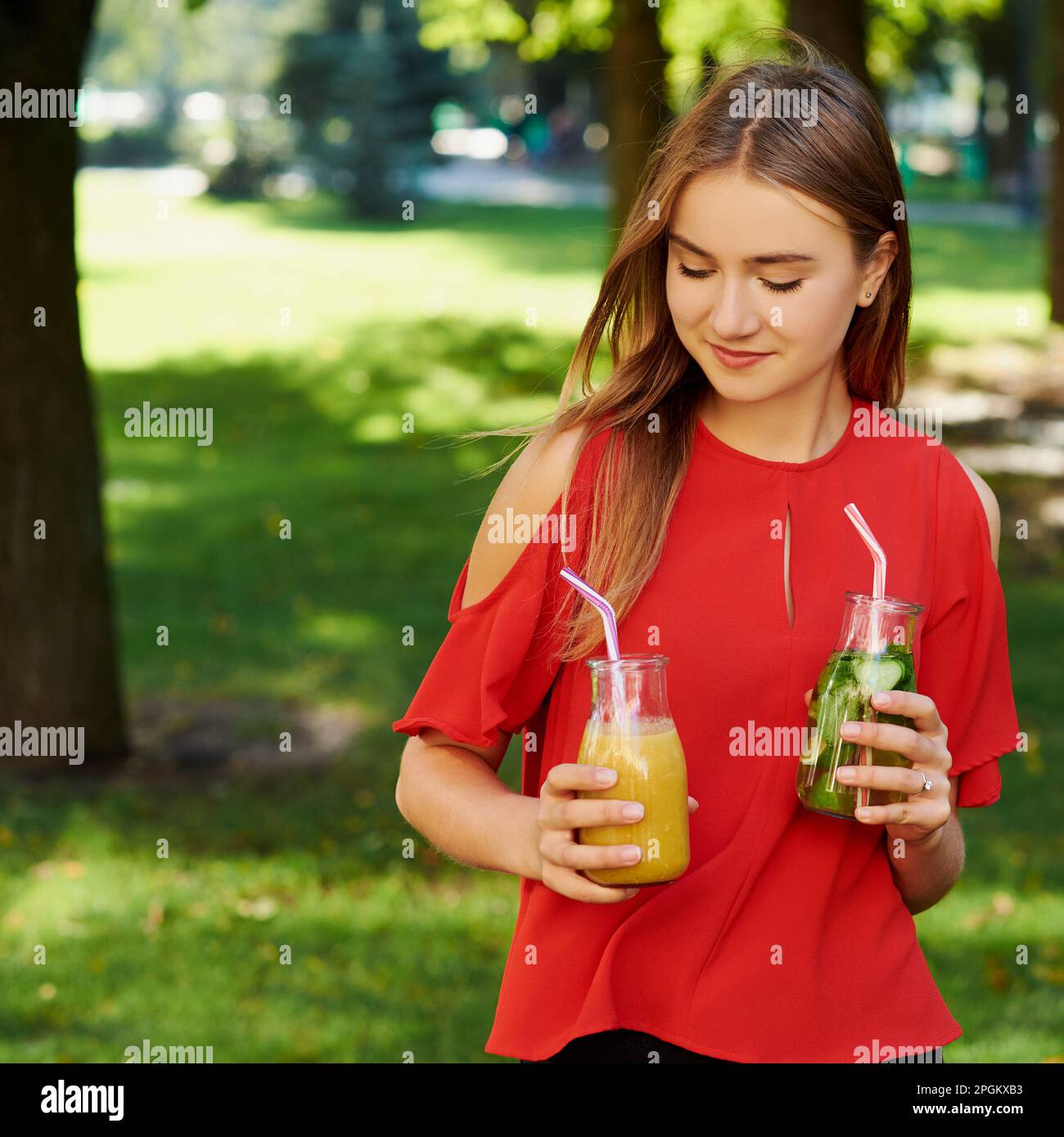 Healthy lifestyle. Happy young woman with detox Stock Photo - Alamy