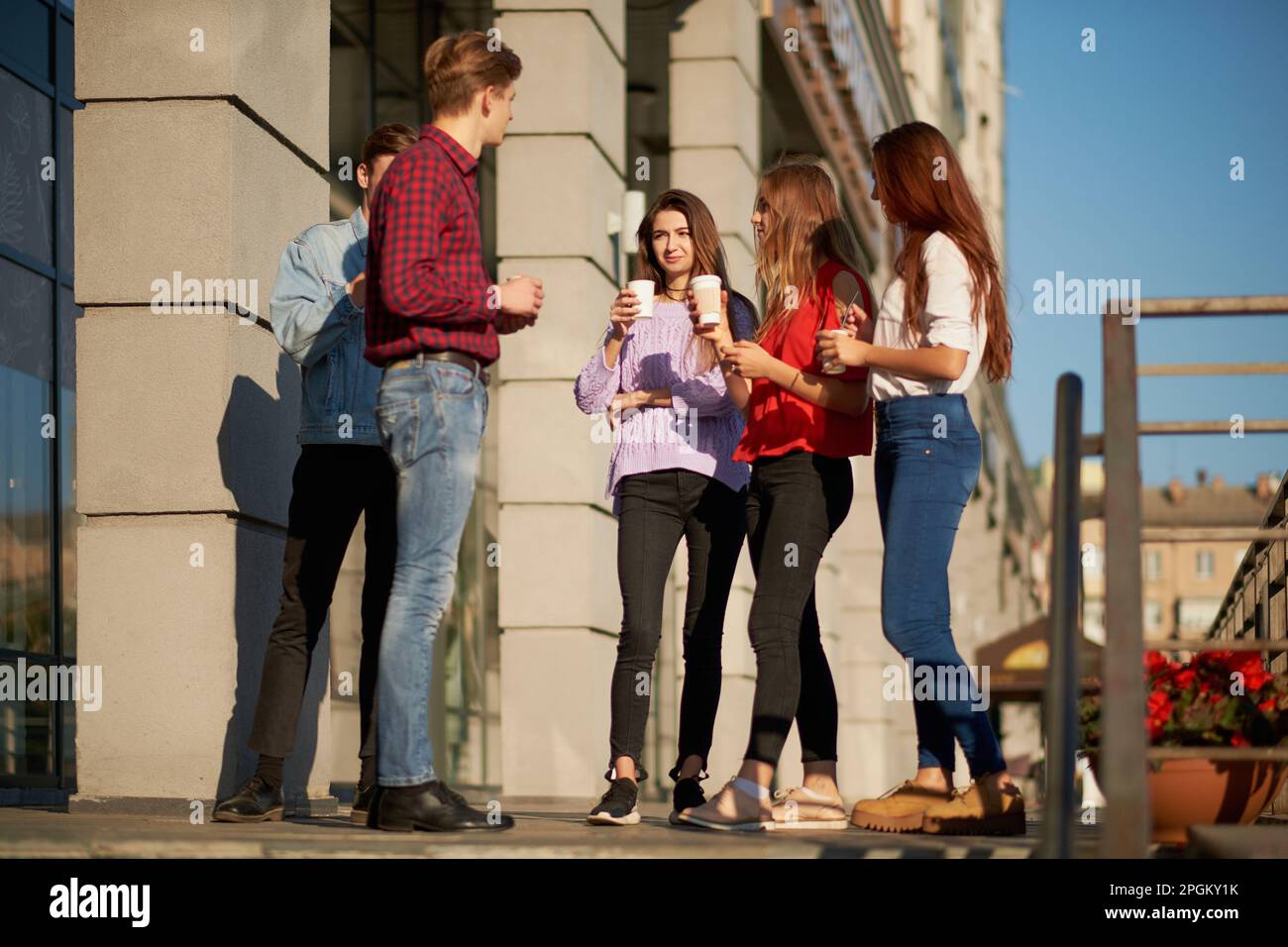 Employees enjoying cup of coffee to go on break Stock Photo - Alamy