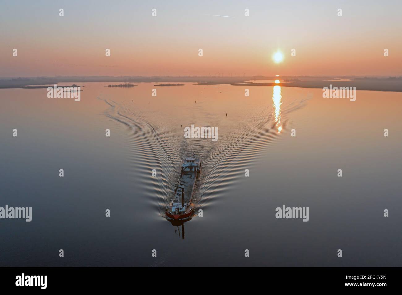 Aerial from a freighter cruising on a frisian lake in the Netherlands ...