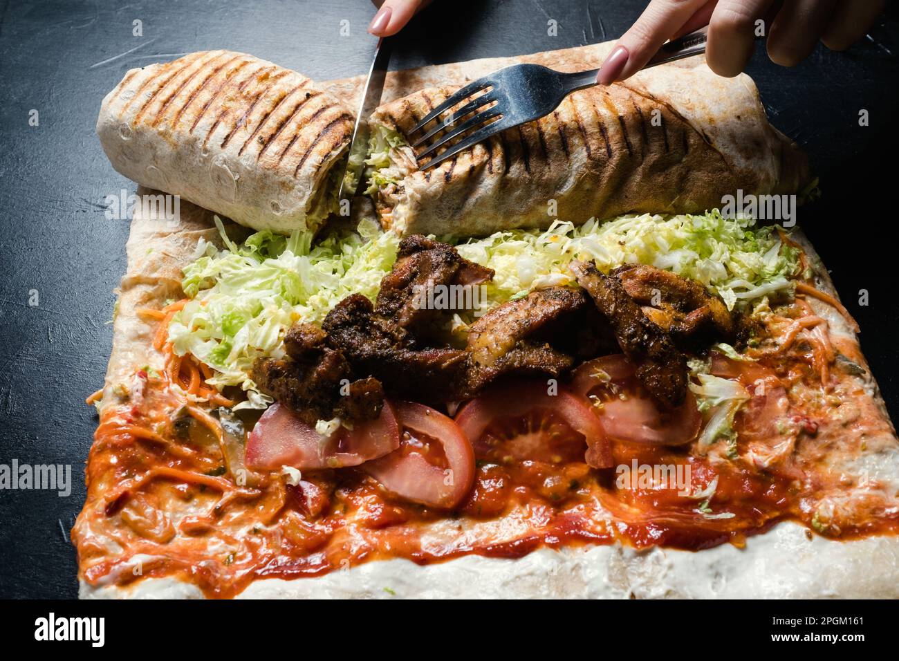 shawarma tasting traditional cuisine fast food Stock Photo - Alamy