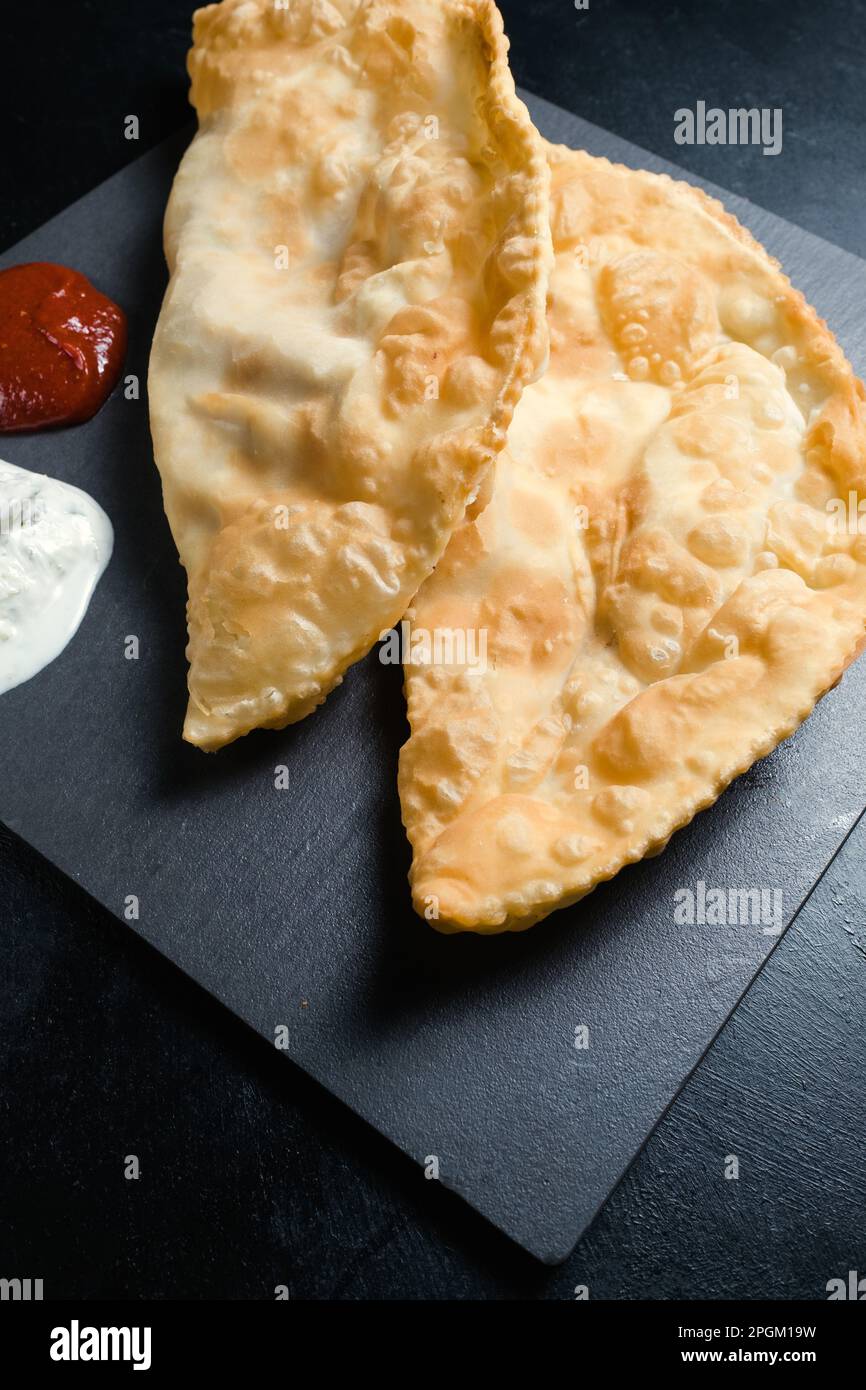 meat pasty chebureki caucasian cuisine fatty food Stock Photo - Alamy
