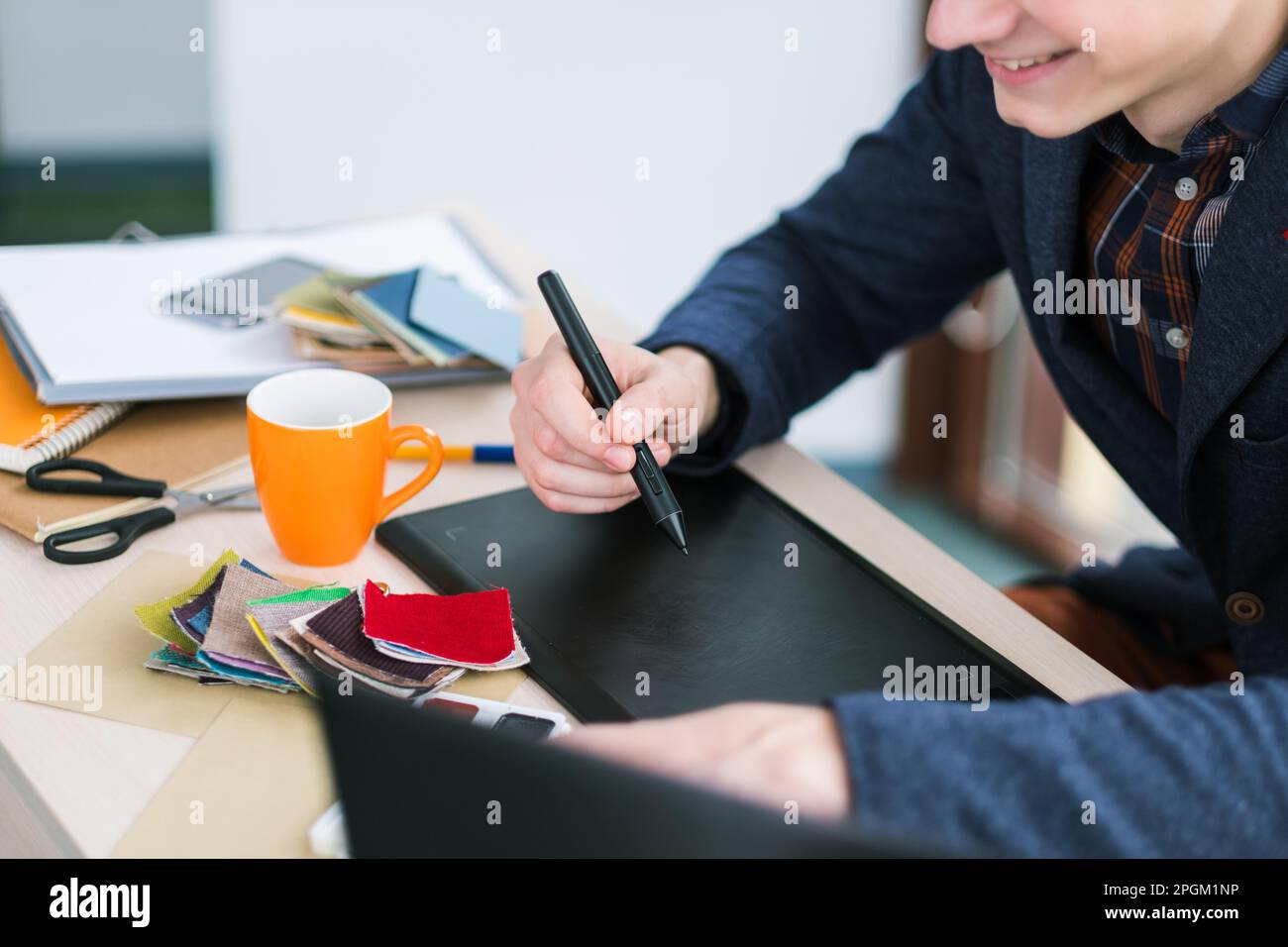 fashion designer sketching creation ideas samples Stock Photo - Alamy