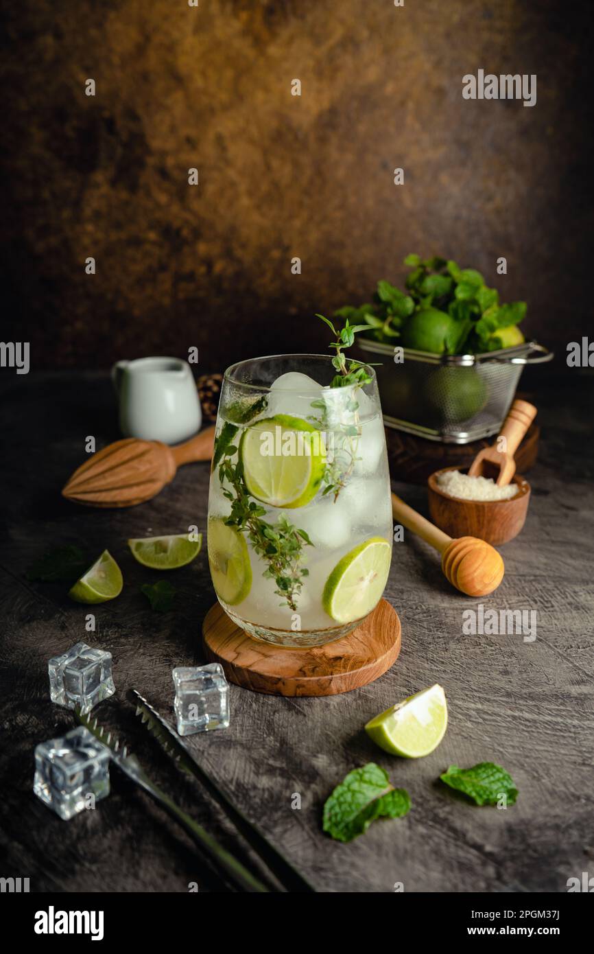 Iced Mojito cocktail long rum drink with fresh mint, fresh thyme, lime ...