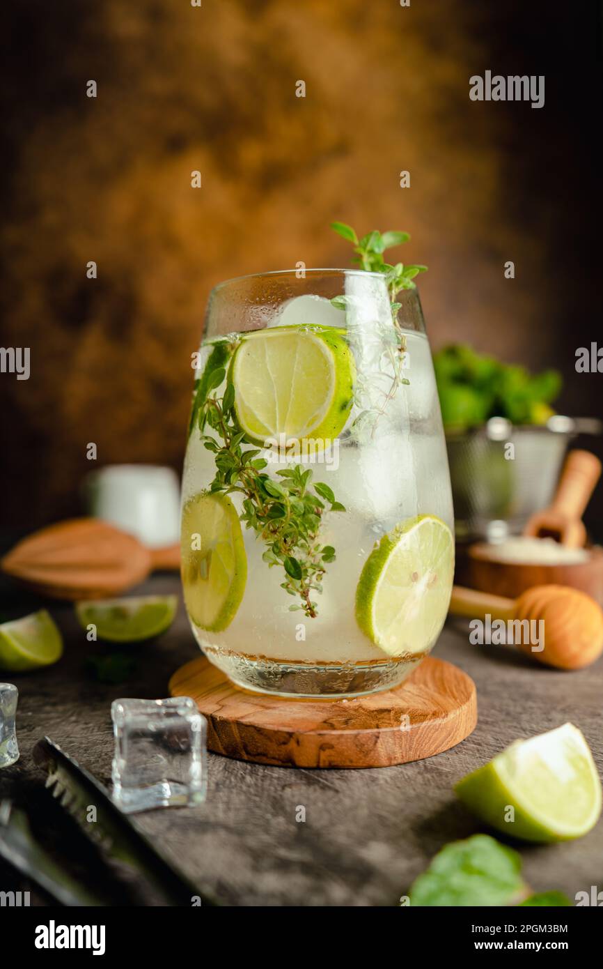 Iced Mojito cocktail long rum drink with fresh mint, fresh thyme, lime ...