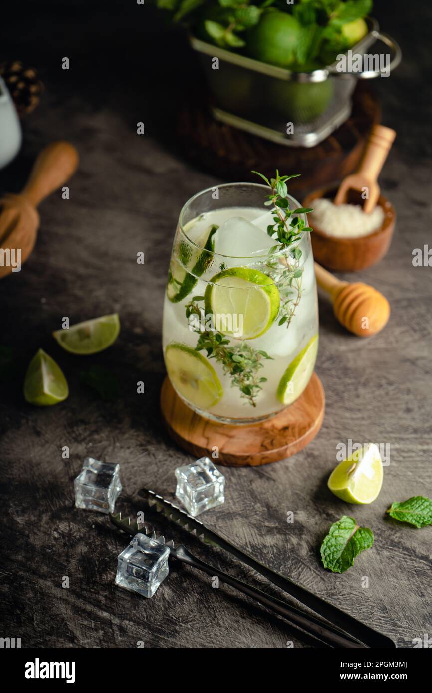 Iced Mojito cocktail long rum drink with fresh mint, fresh thyme, lime ...