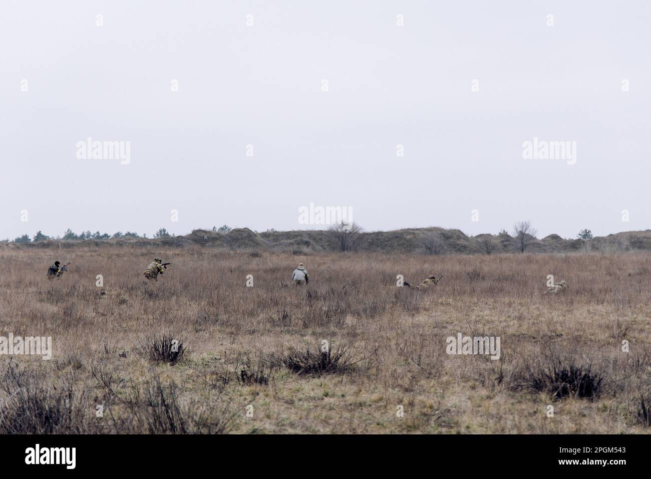 Gun armed man grass hi-res stock photography and images - Alamy