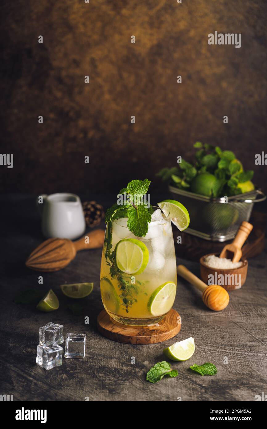 Iced Mojito cocktail long rum drink with fresh mint, fresh thyme, lime ...