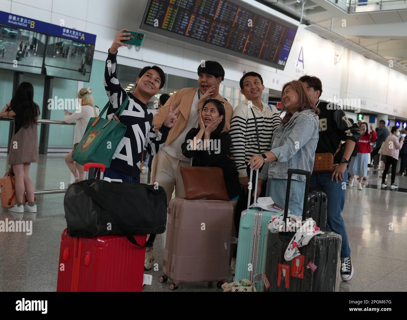 Inbound passengers arrive at the Arrival Hall of Hong Kong International Airport, Chek Lap Kok ...