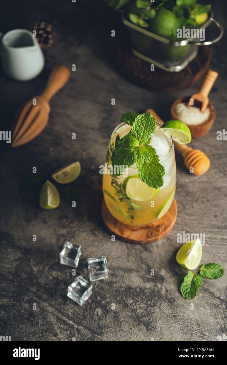 Iced Mojito cocktail long rum drink with fresh mint, fresh thyme, lime ...