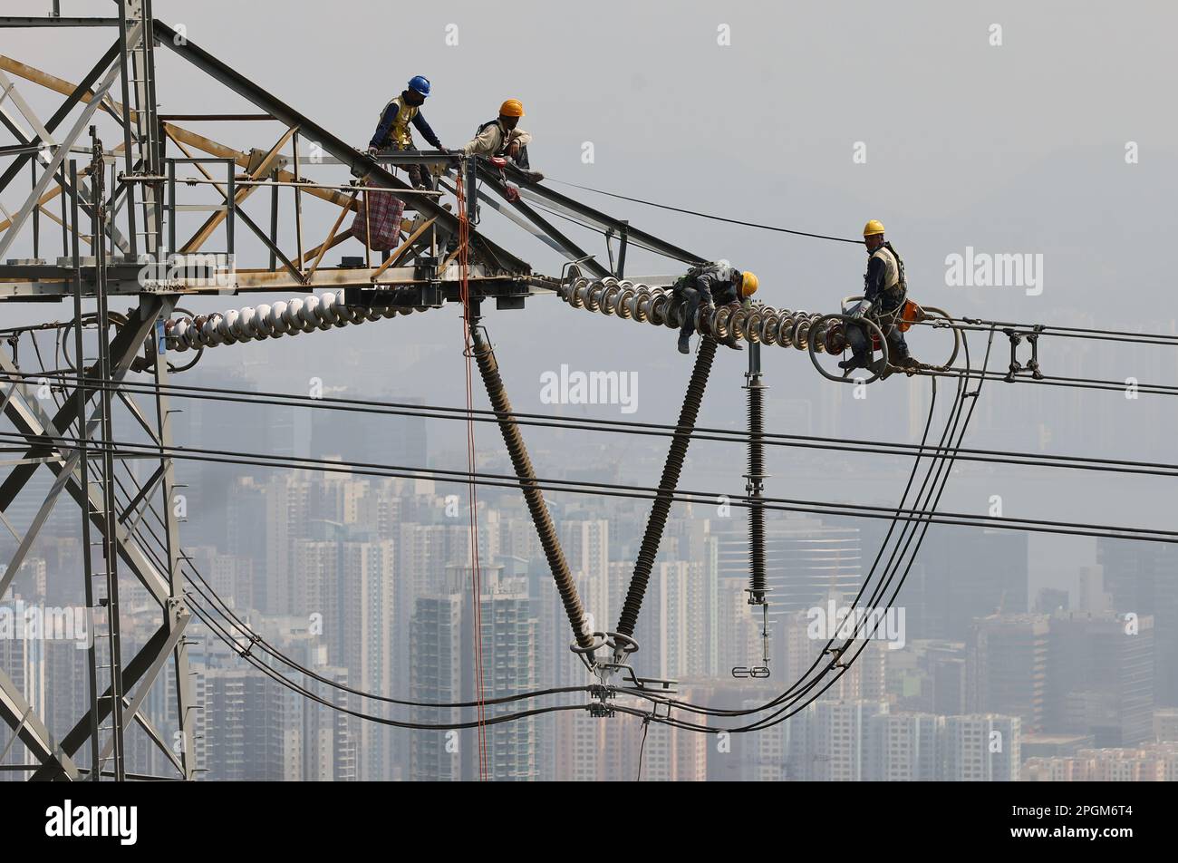 Workers repair faulty electricity tower near Shatin Pass Road ...