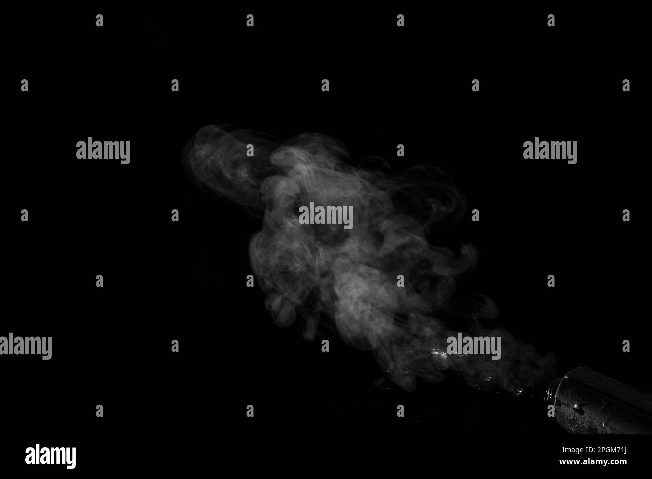 White curling dense smoke steam rising up is isolated on black ...