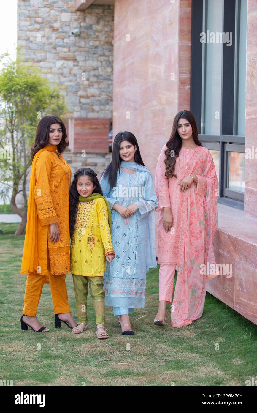 Female models posing outdoors wearing dresses Indian Pakistani Asian ...