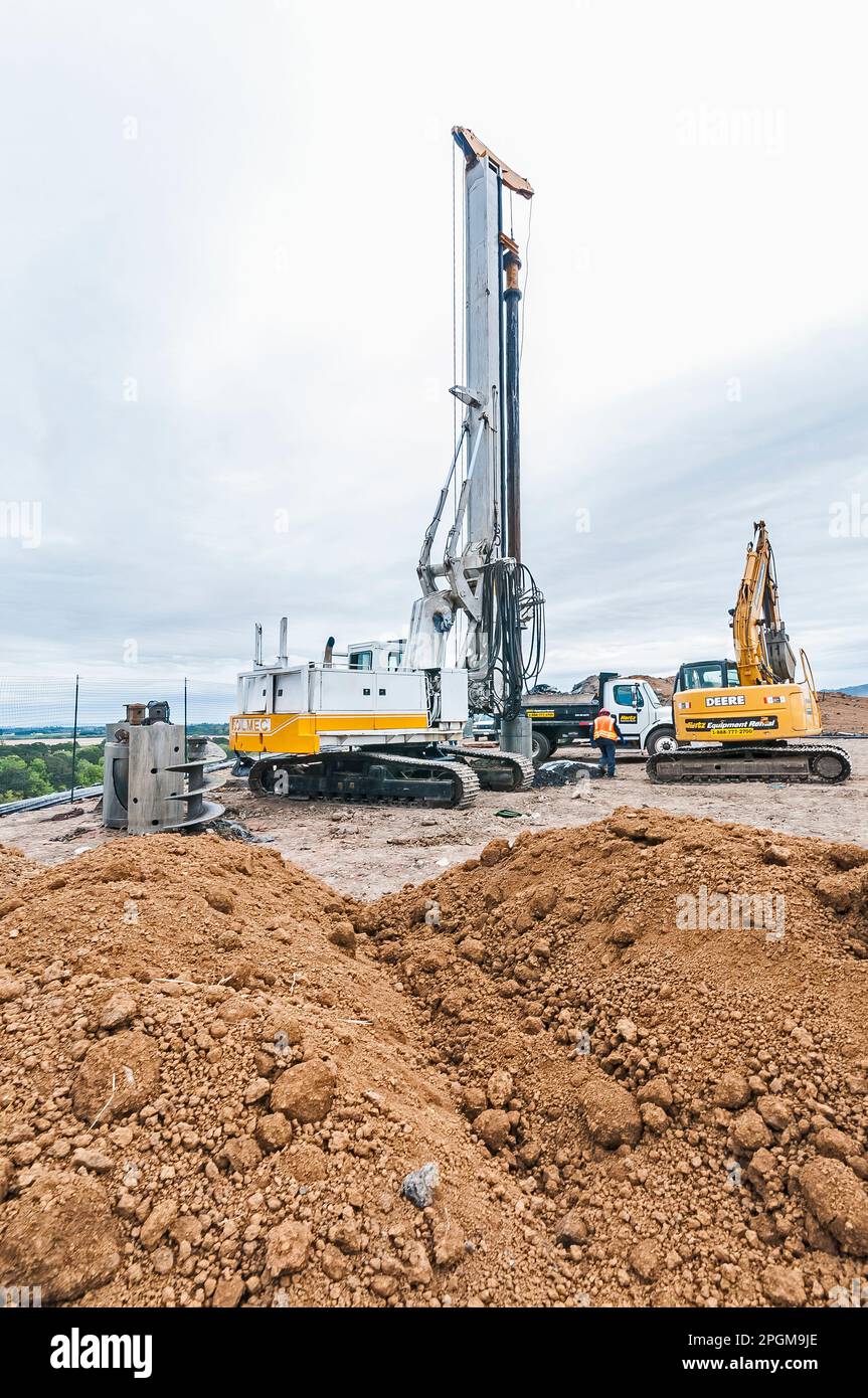 A power shovel and a methane gas well drilling rig at an active ...