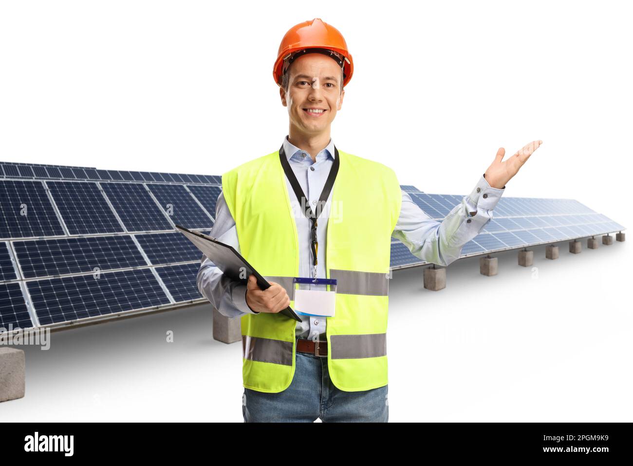 Engineer wearing a reflective vest and helmet and showing a solar panel ...