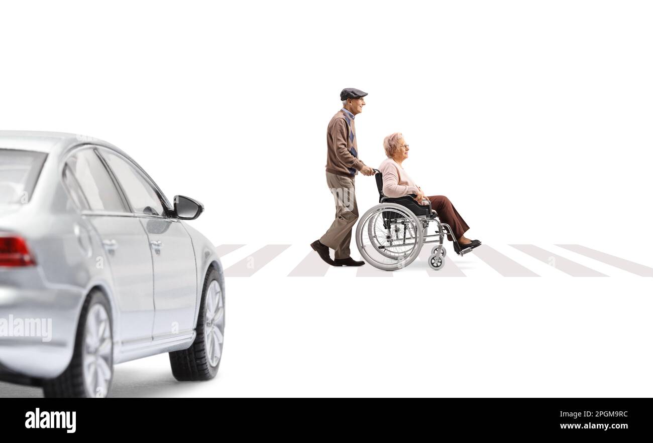 Full length profile shot of an elderly man pushing an elderly woman in ...