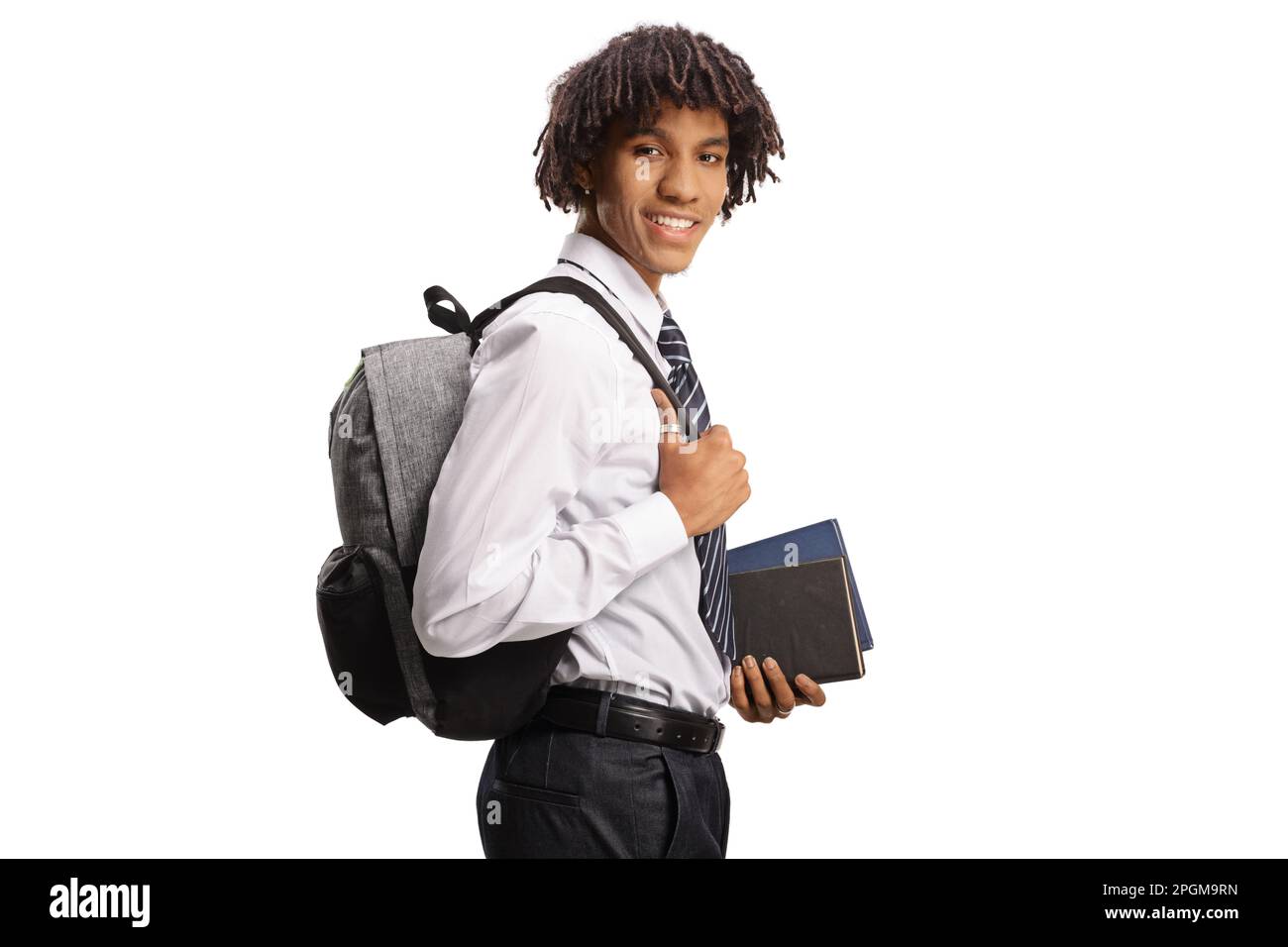 African american male student in a college uniform holding books and ...