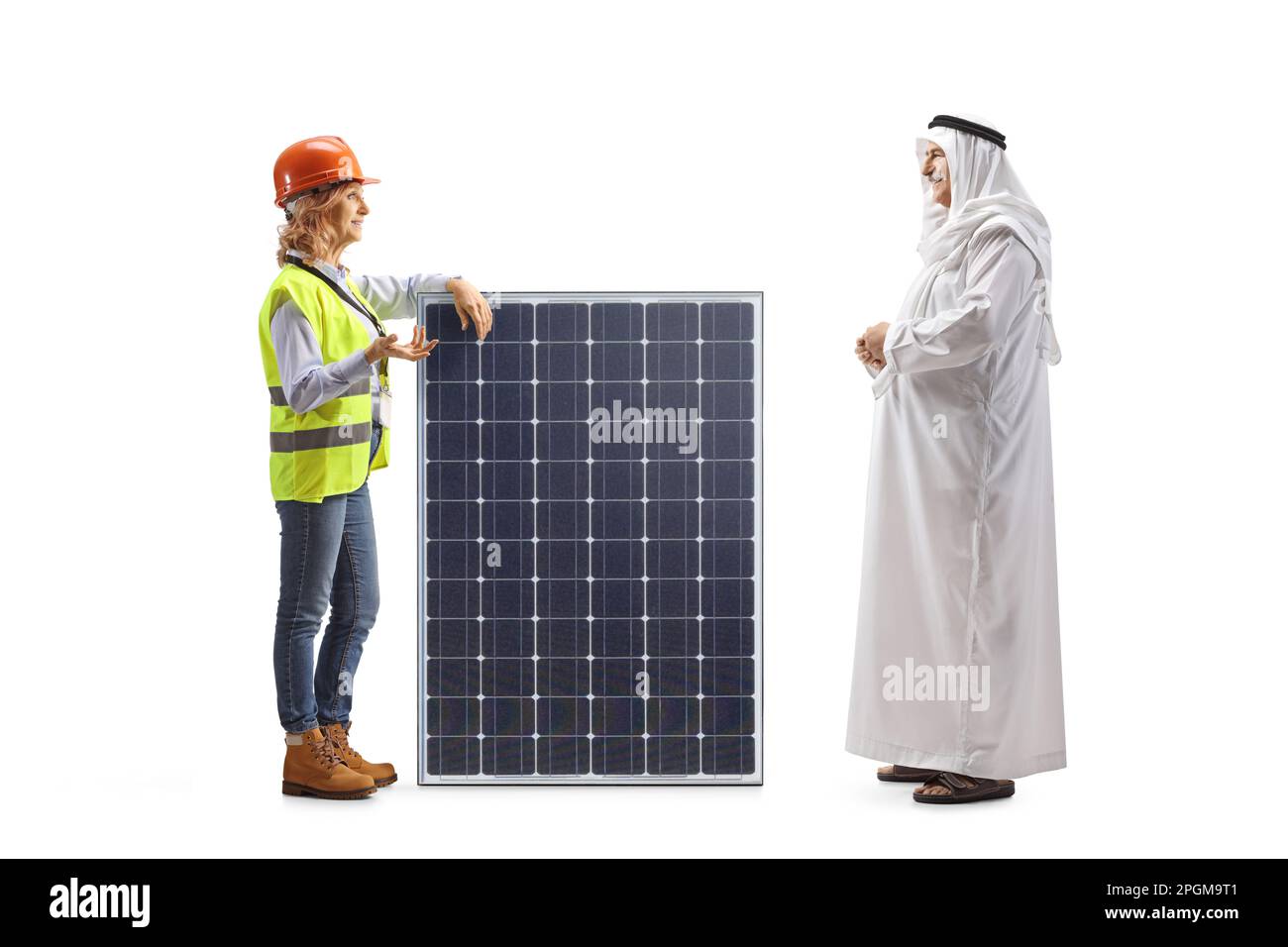 Female engineer with a solar panel talking to a mature arab man ...