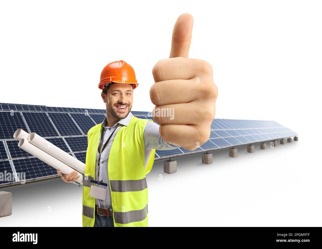 Cheerful male engineer with blueprints gesturing thumbs up at a ...