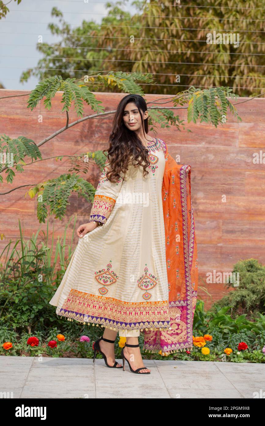 Female model posing outdoors wearing summer dress Indian Pakistani ...