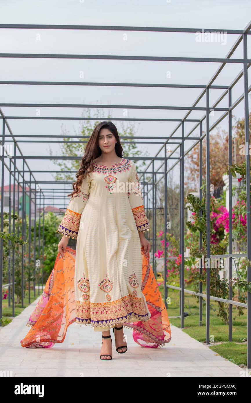 Female model posing outdoors wearing summer dress Indian Pakistani ...