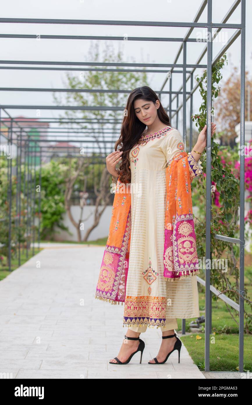 Female model posing outdoors wearing summer dress Indian Pakistani ...