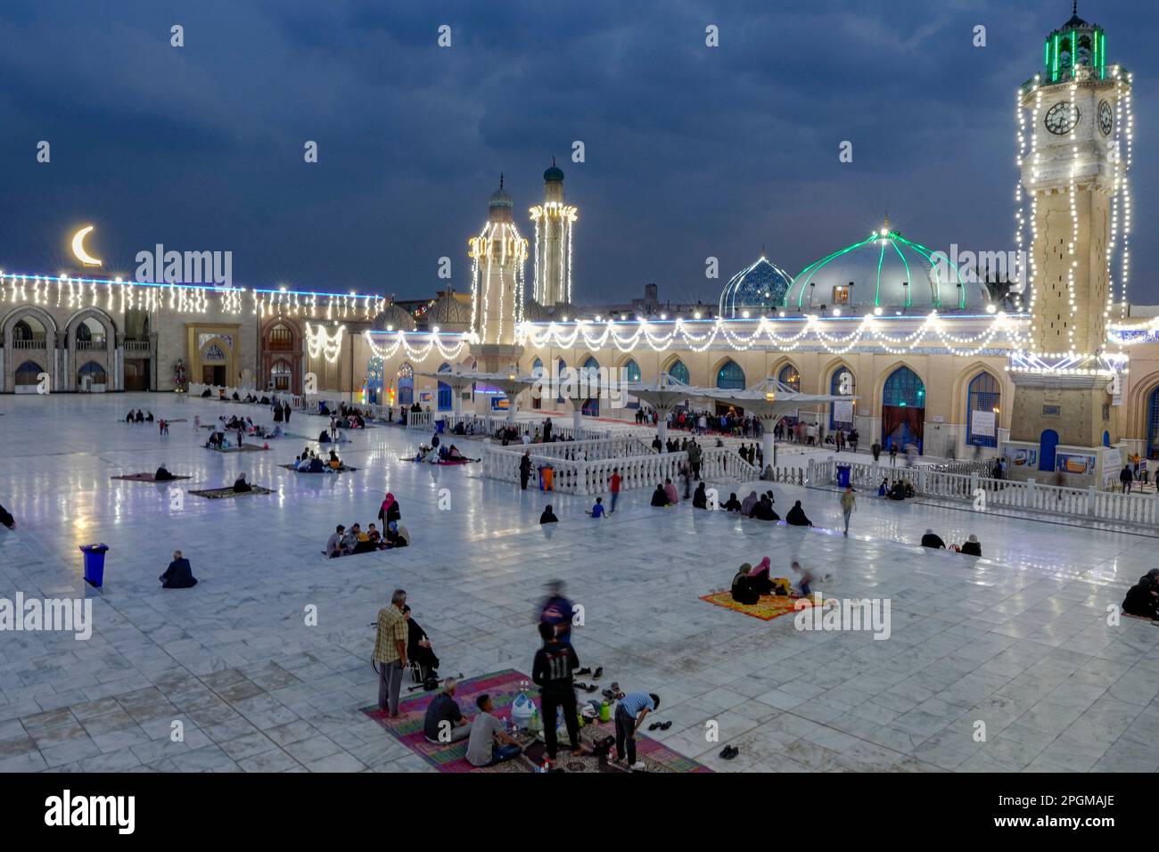 Muslims gather for a free public Iftar meal during the first day of ...