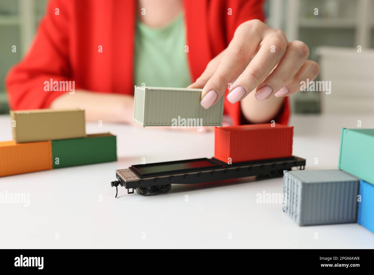 Hand of woman putting block on truck for transportation Stock Photo - Alamy
