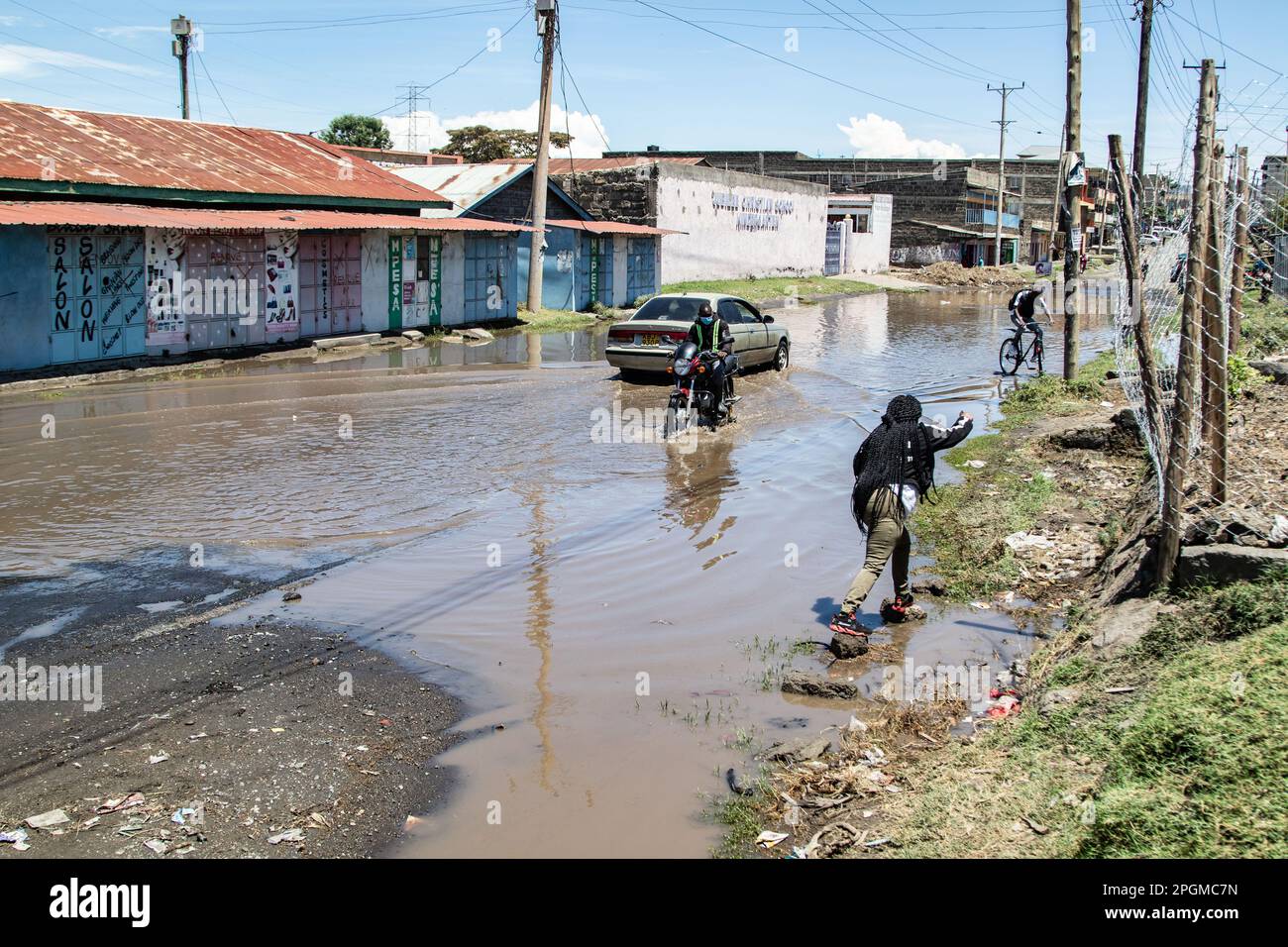 Nakuru, Kenya. 23rd Mar, 2023. A motorists drives through a flooded ...
