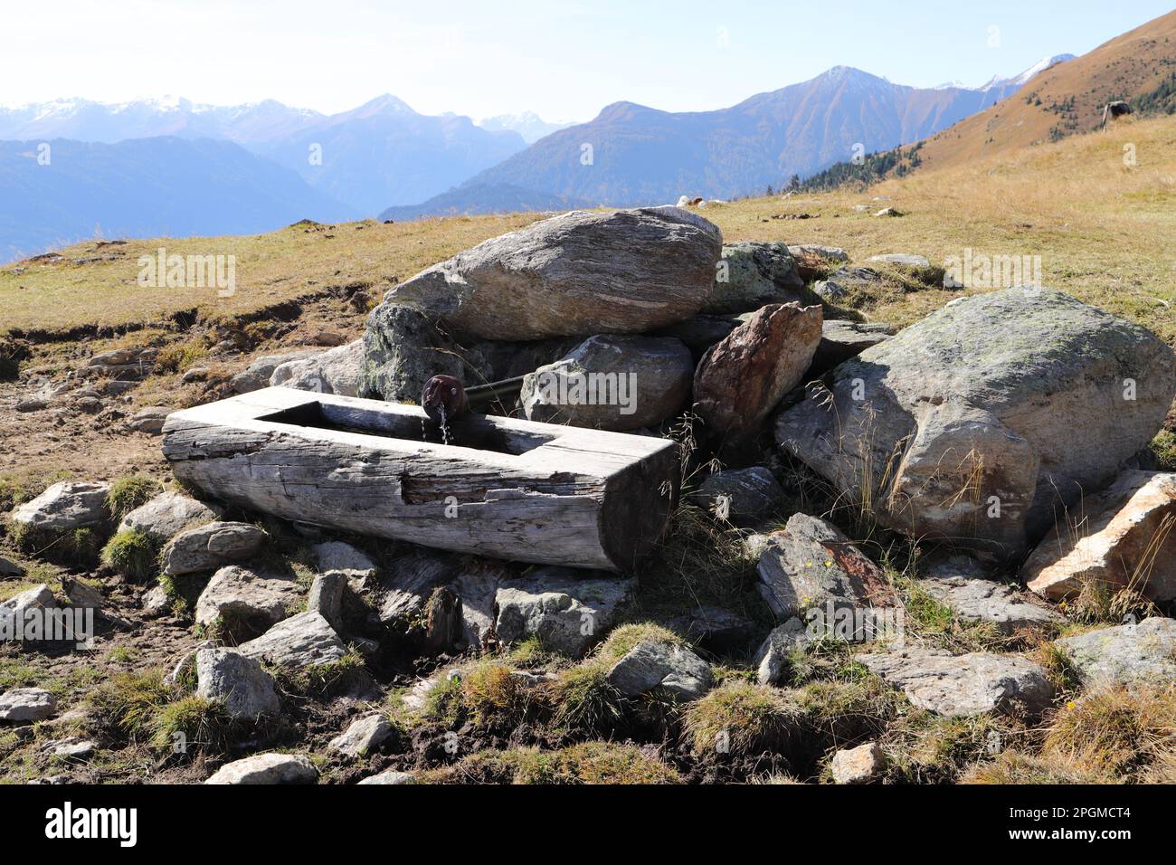 Wooden water trough in the mountains hi-res stock photography and ...
