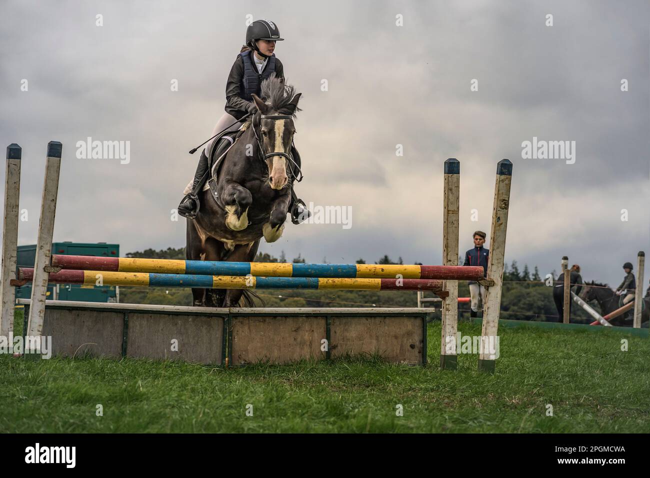 A girl rides her horse over one of the jump fences. 41st Johnstown ...