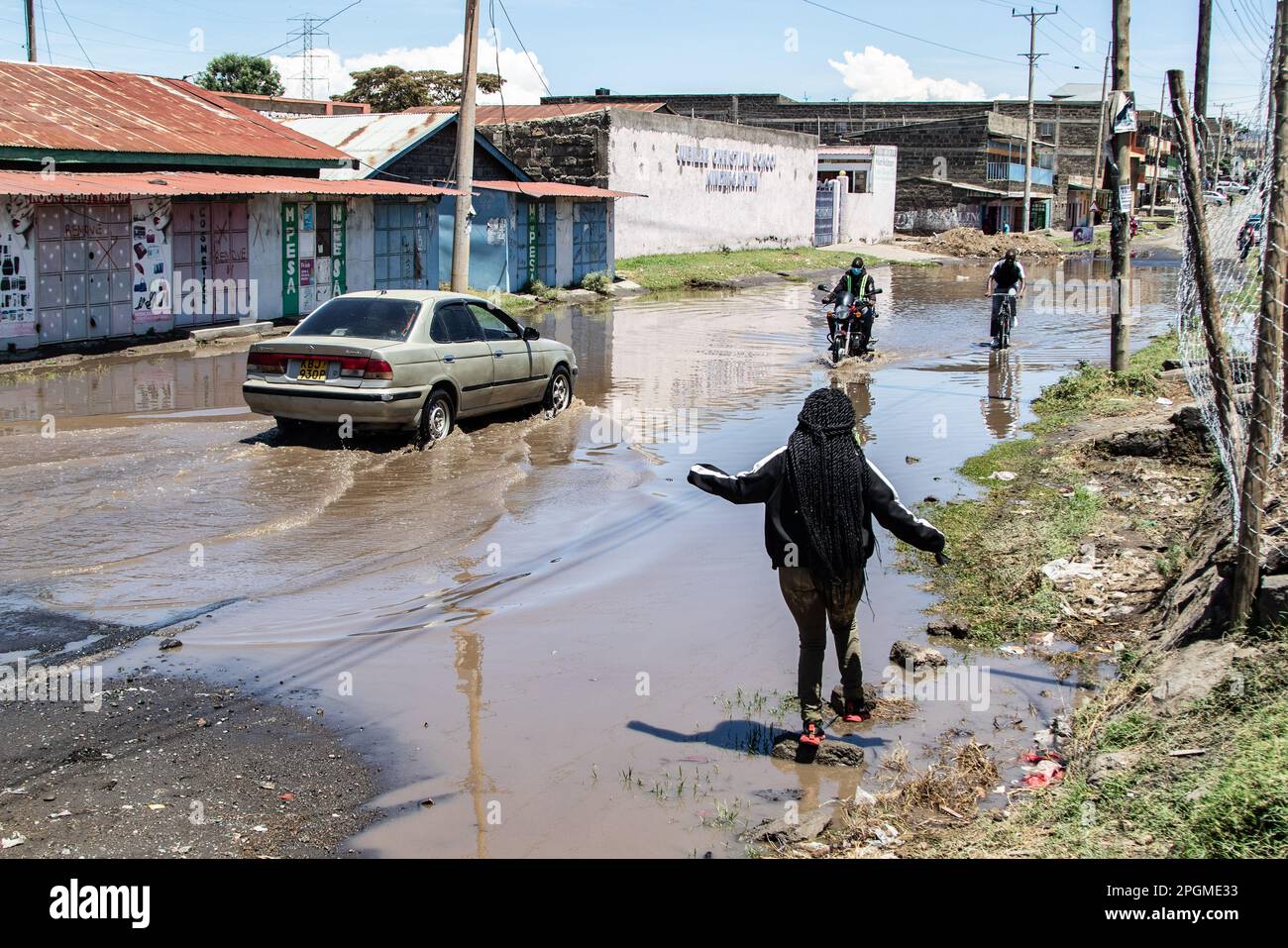 Nakuru, Kenya. 23rd Mar, 2023. A motorists drives through a flooded ...