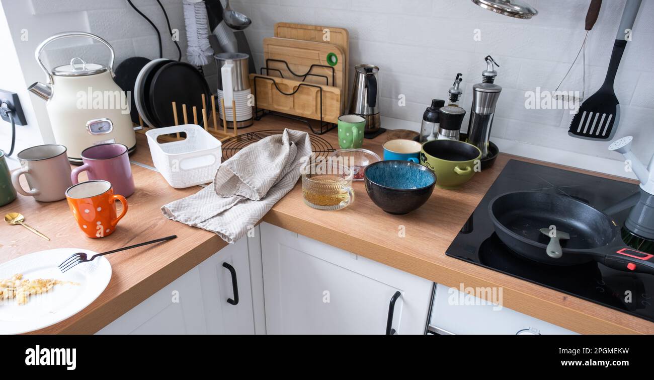 A mess in the kitchen, dirty dishes on the table, scattered things ...