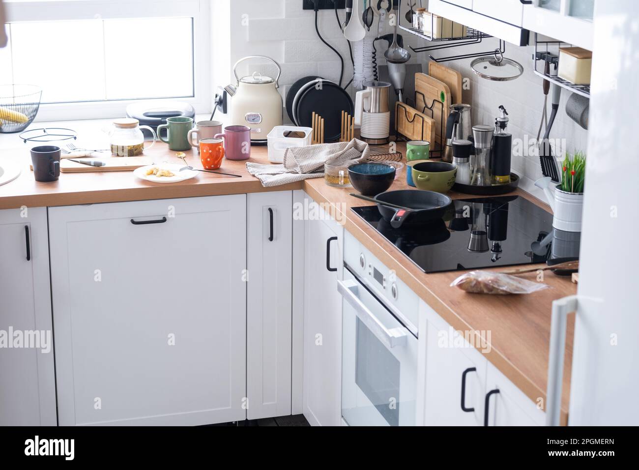 A mess in the kitchen, dirty dishes on the table, scattered things ...