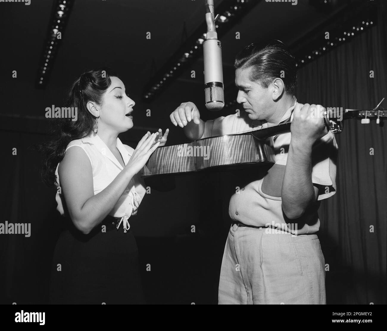 Yma Sumac, left, Peruvian singer whose voice has a four octive range ...