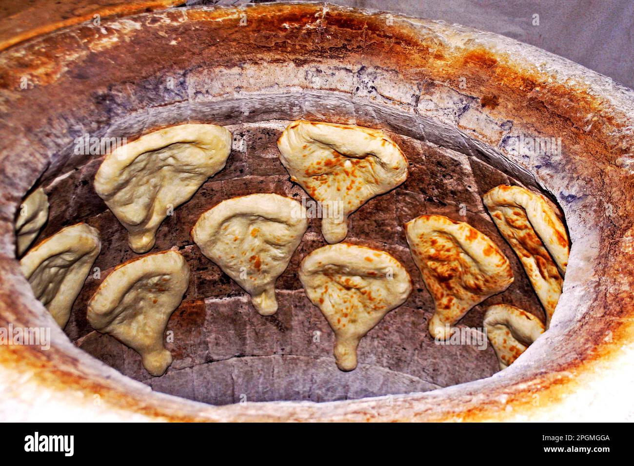 Georgian lavash in the oven Stock Photo - Alamy