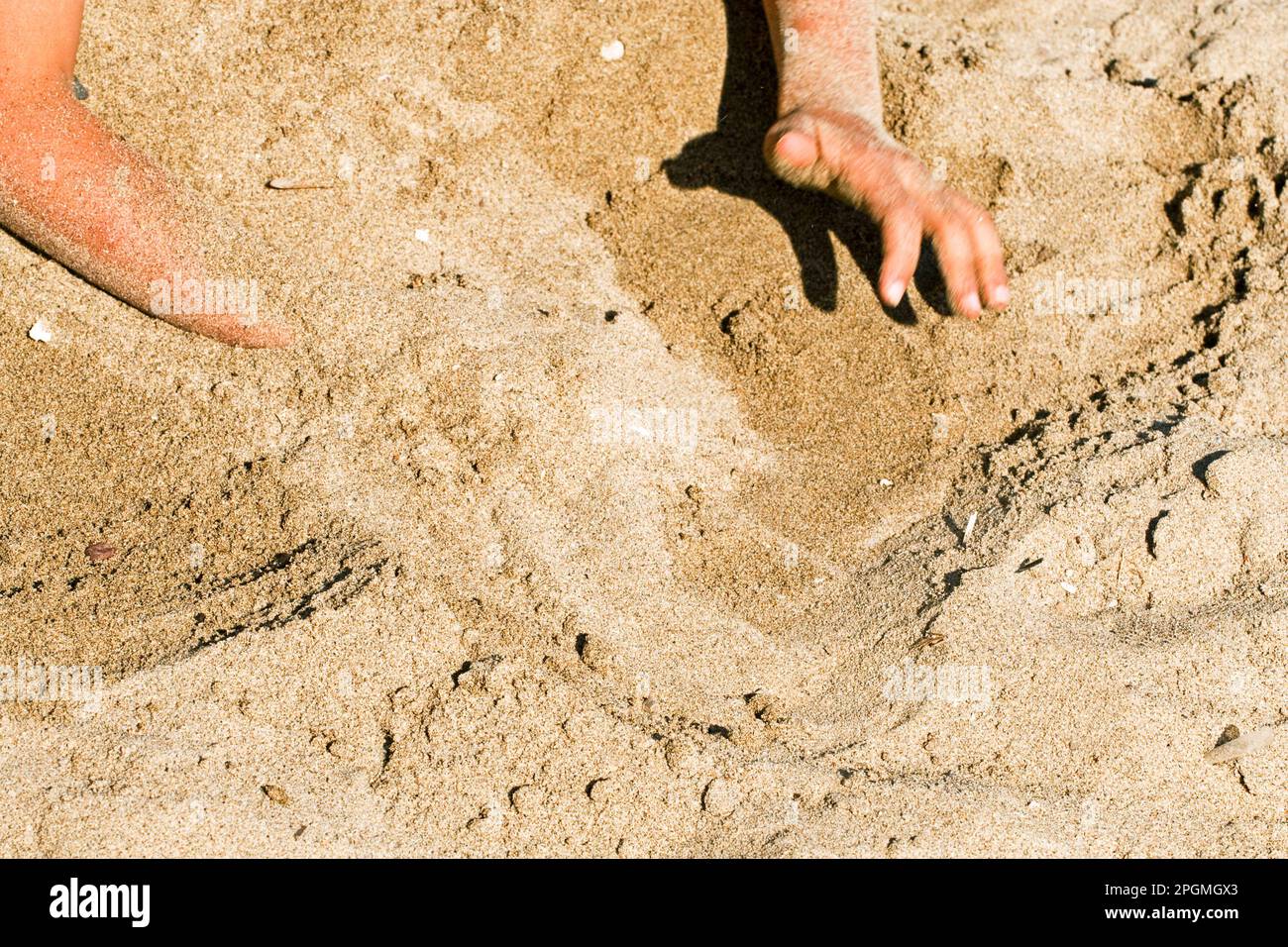 children's fingers are playing on the sand Stock Photo - Alamy