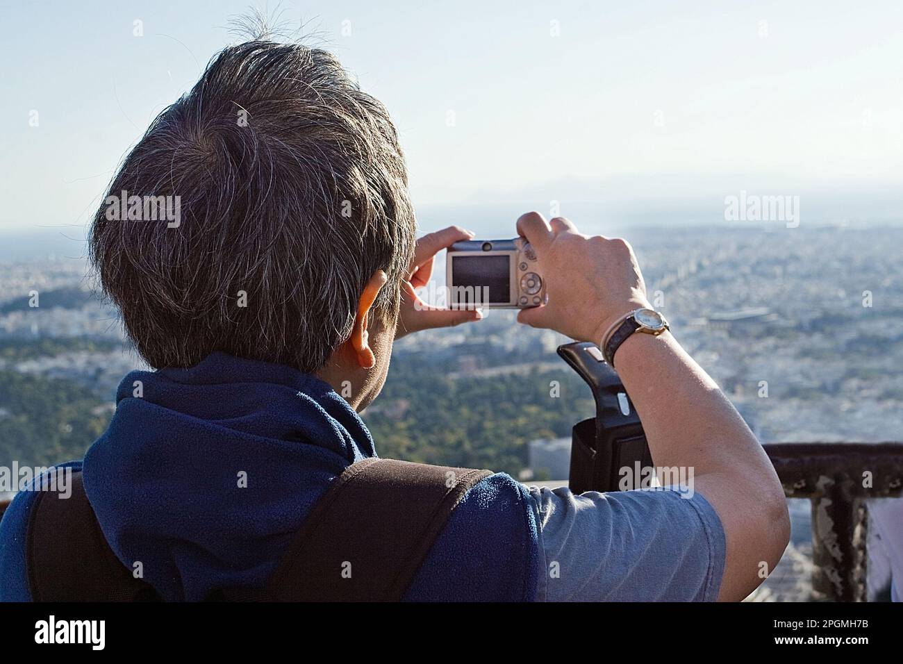 man from behind takes pictures Stock Photo - Alamy