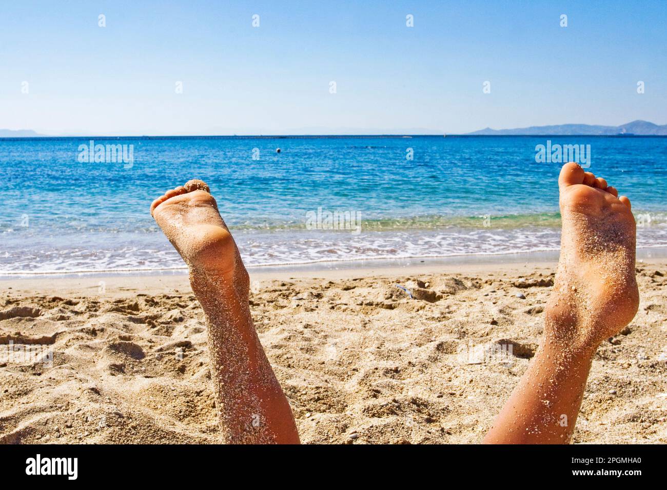 raised feet on the beach Stock Photo - Alamy