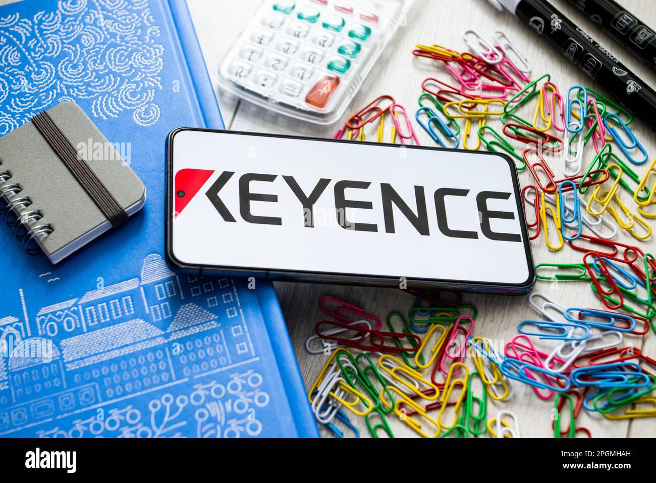 In this photo illustration a Keyence logo seen displayed on a ...