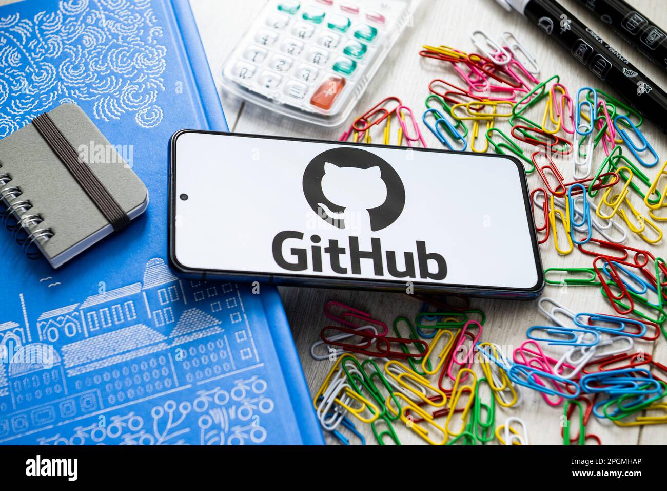 In this photo illustration a GitHub logo seen displayed on a smartphone ...