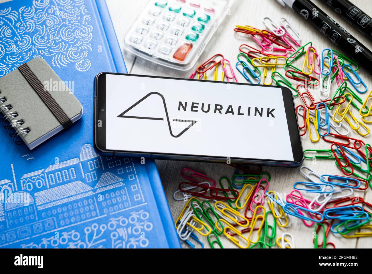 In this photo illustration a Neuralink logo seen displayed on a ...