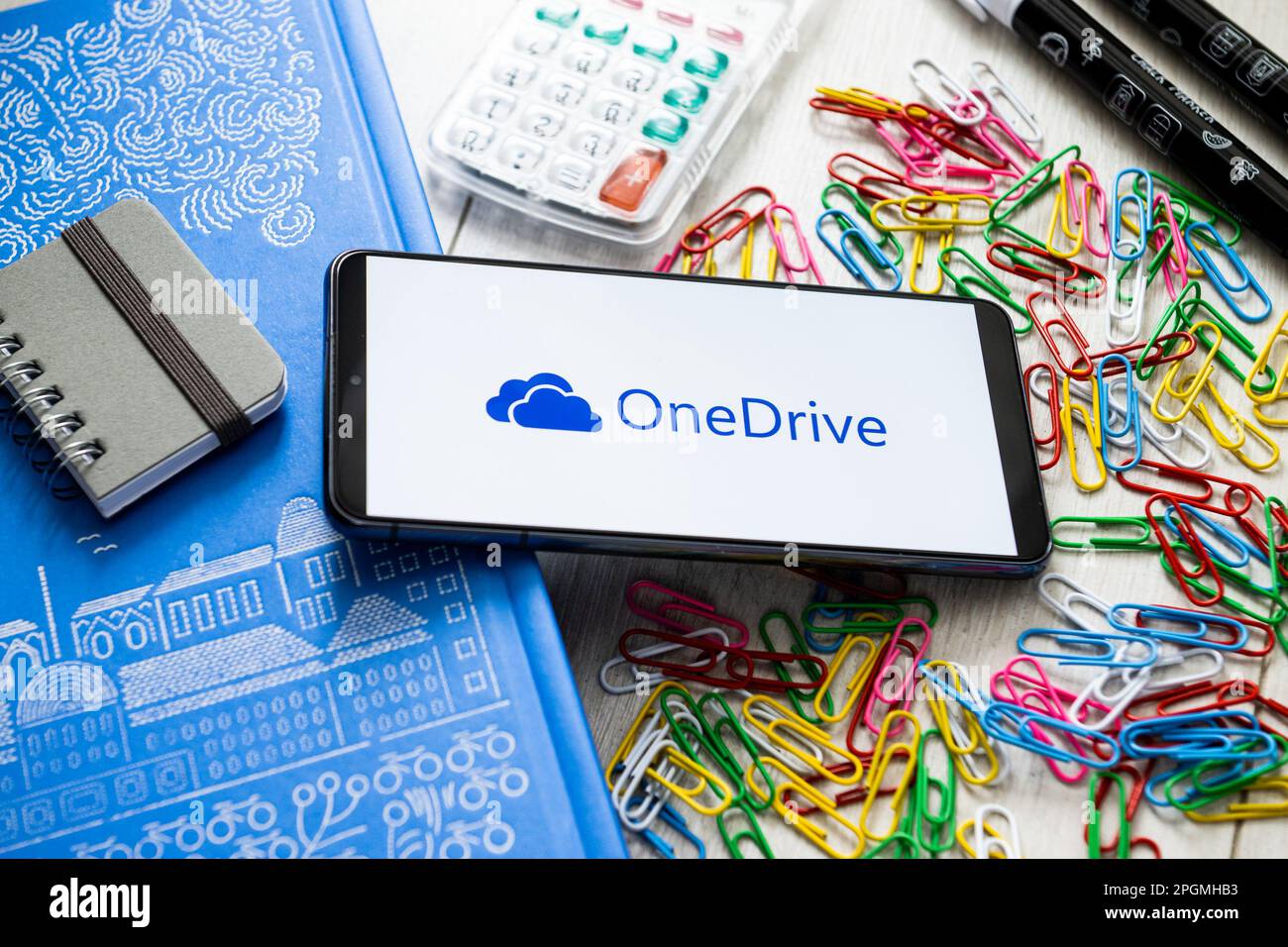 In this photo illustration the OneDrive logo seen displayed on a ...