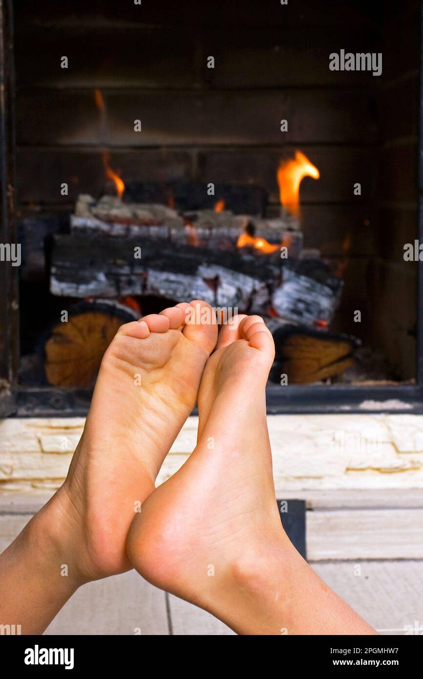 Feet to the fire hi-res stock photography and images - Alamy