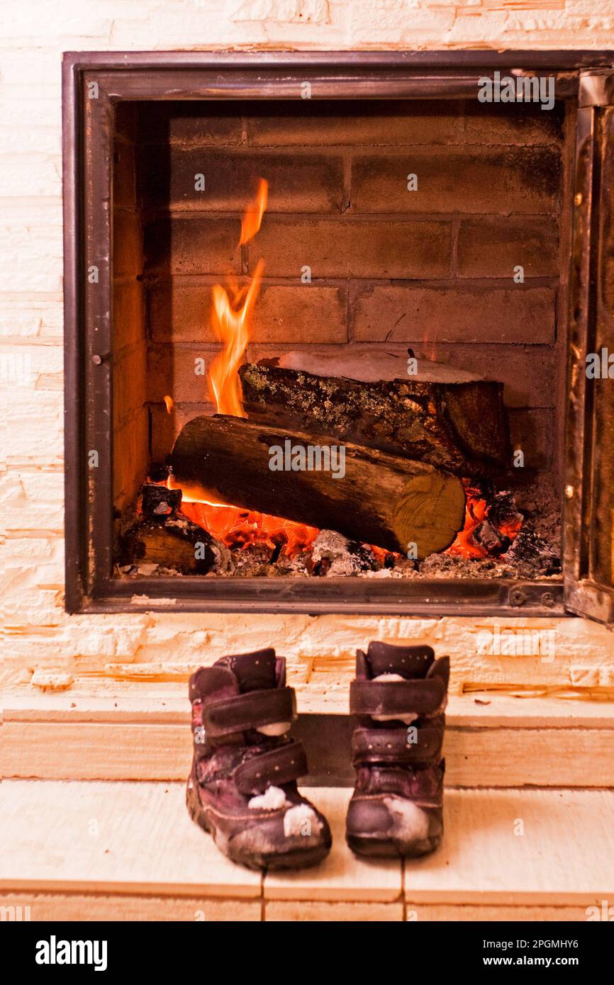 Winter boots fireplace hi-res stock photography and images - Alamy