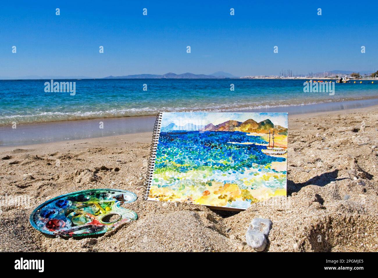 drawing from the nature of the sea on the beach with watercolors and a ...